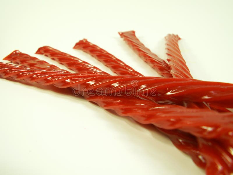 Red Licorice Ropes Fanned Out Isolated on White Stock Photo - Image of ...