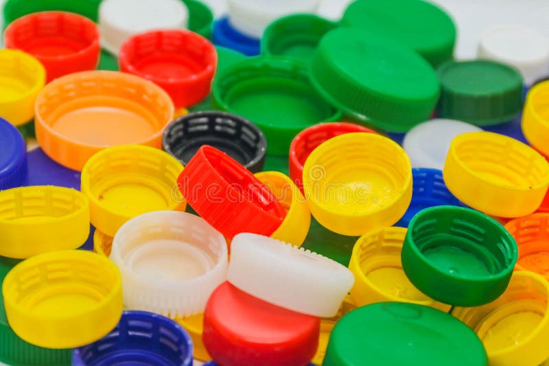 Plastic Lids of Different Colors on a White Background Stock Photo ...