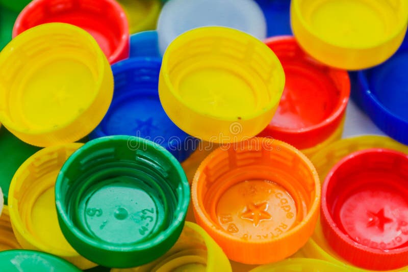 Plastic Lids of Different Colors on a White Background Stock Photo ...