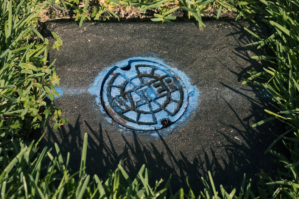 Lid of a water valve box stock photo. Image of metal - 31902784