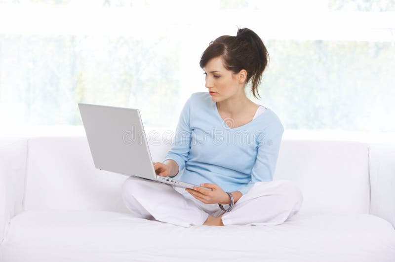 Smiling Woman Multitasking Housework and Laptop Stock Image - Image of ...