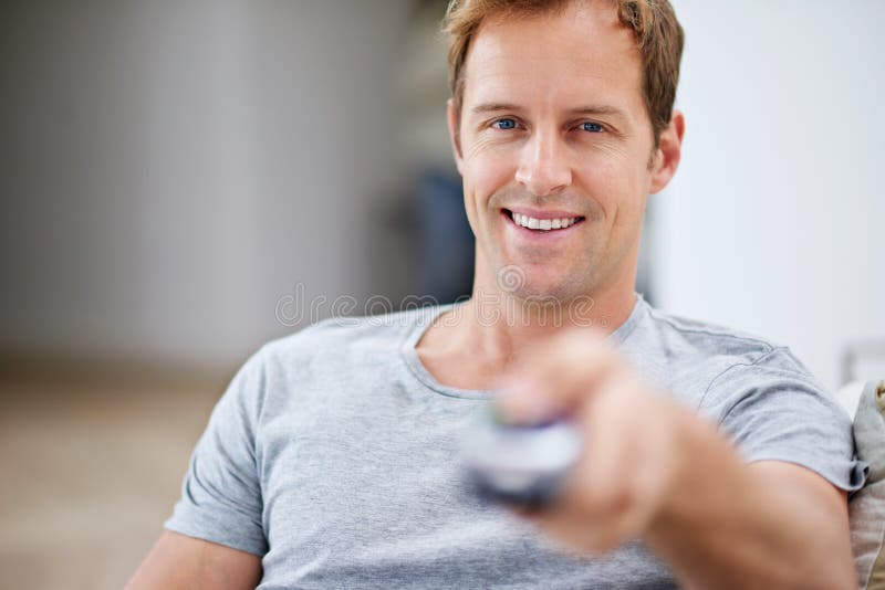 The Life of a Bachelor. a Handsome Man Holding a Remote Control. Stock ...
