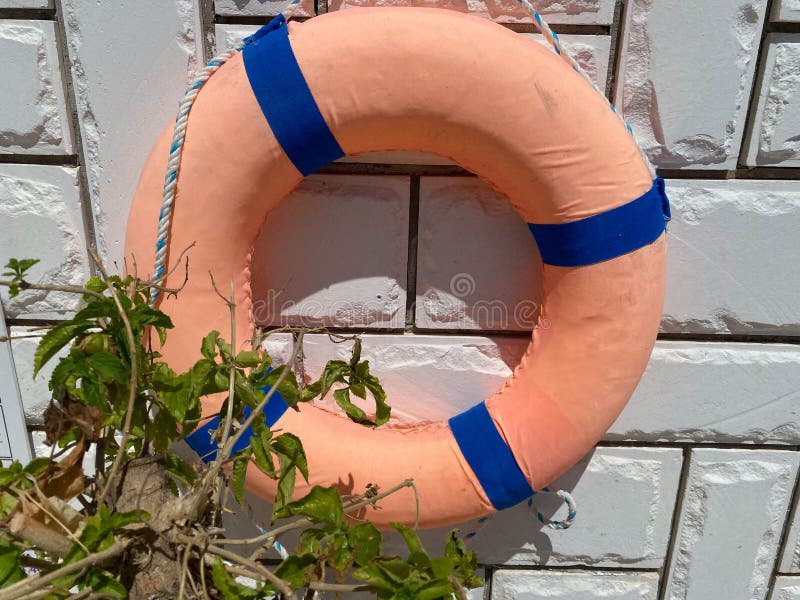 Life Belt, Rescue Ring on a Brick Wall Stock Photo - Image of ...