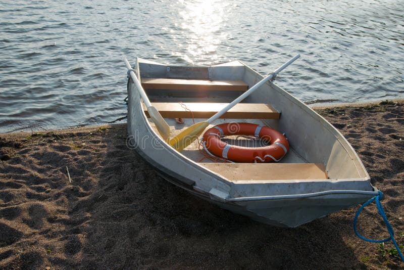 Life boat on shore stock photo. Image of buoy, lake, rowing - 76597338