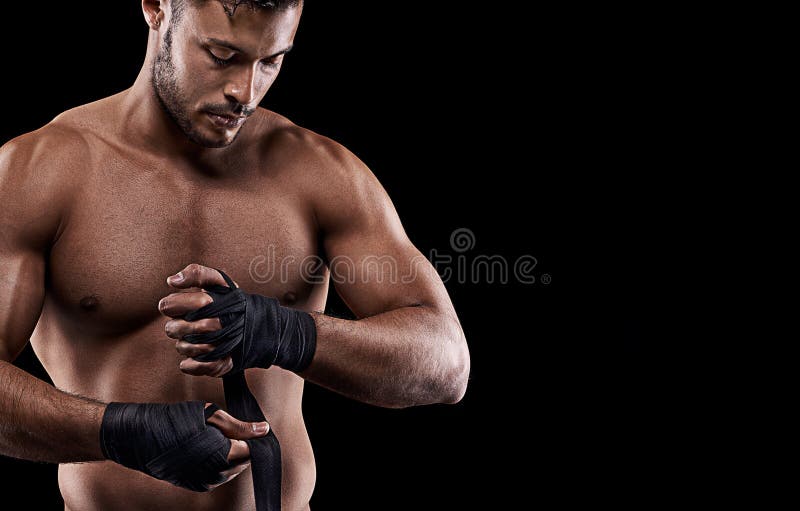 The Life of a Fighter. Studio Shot of a Young Boxer Isolated on Black ...
