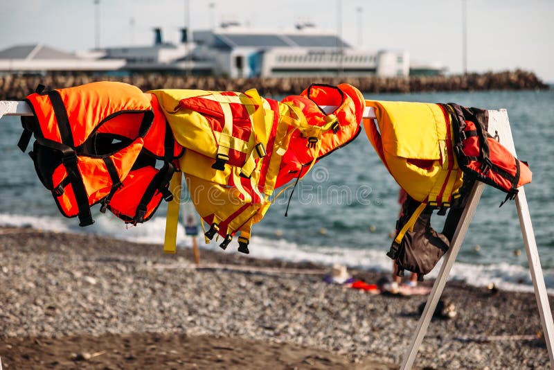 Life jackets on beach stock image. Image of circle, lifebuoy - 171558225