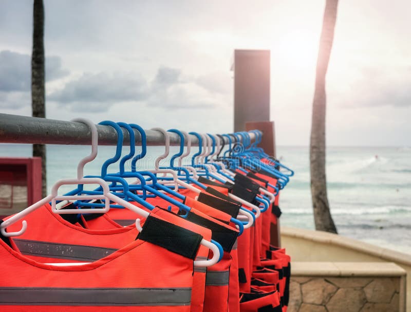 Life Jackets Dry on Hangers at a Beach, Selective Focus Stock Photo ...