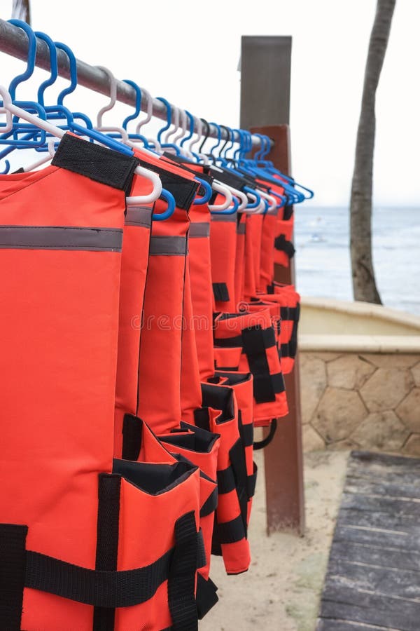 Life Jackets Dry on Hangers at a Beach, Selective Focus Stock Image ...