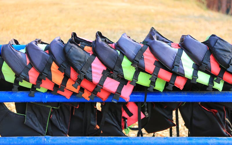 Life Jackets Hanging in the Row Outdoor Stock Image - Image of life ...