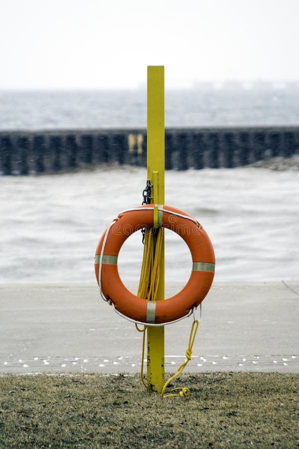 Life Preserver Ring Hanging from Yellow Emergency Pole on Empty Stock ...