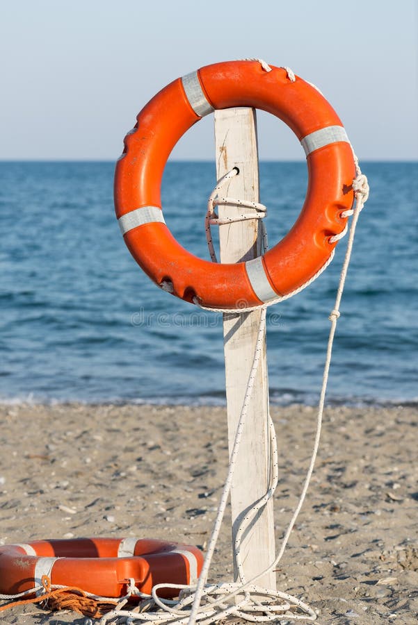 Life Preserver On Sandy Beach Stock Photo - Image of safe, aged: 83398530