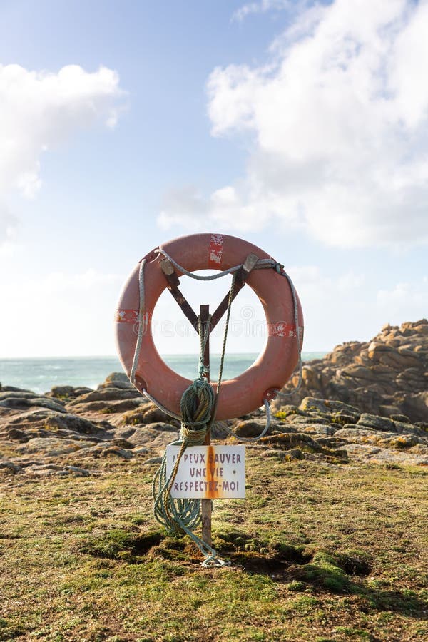 Life Ring Buoy with a Sign at Seaside Stock Photo - Image of support ...