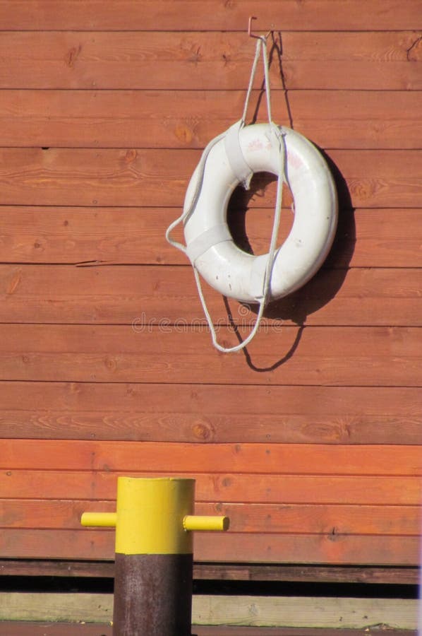 Life ring on dock stock photo. Image of lifesaving, orange - 15216614