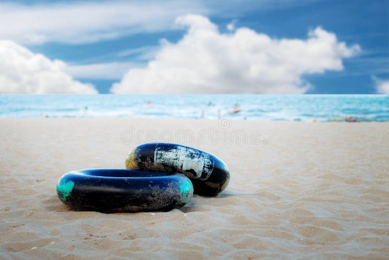 Life ring on sand beach stock image. Image of ocean - 181586011