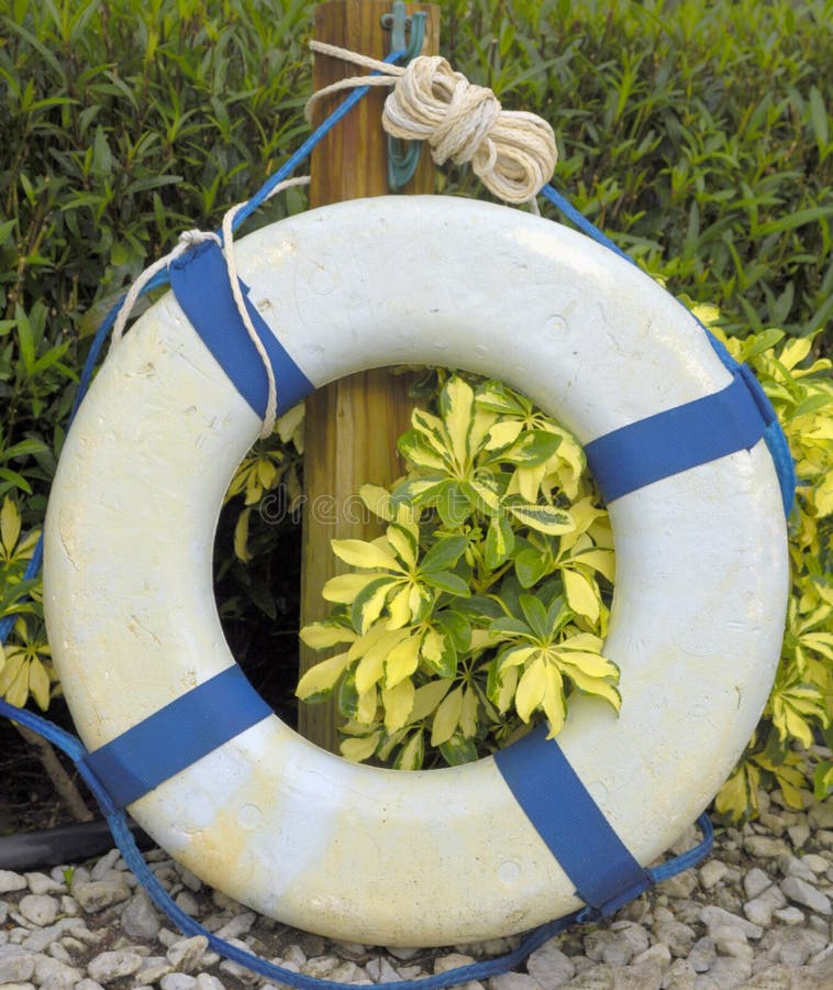 A Worn Life Saver with the Caption Help Wanted Stock Photo - Image of ...