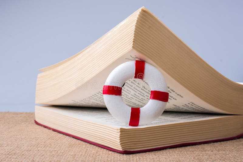 Books Half Open with a Life Saver Inside Stock Photo - Image of save ...