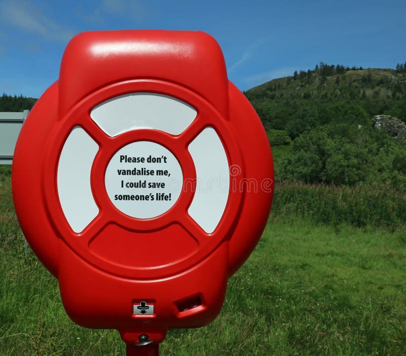 Life Saver Device in Red Casing at a Lakeside Stock Photo - Image of ...