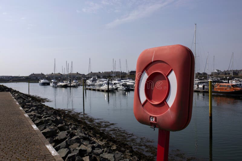 Life Saving Emergency Floatation Ring on the Side of a Marina Stock ...