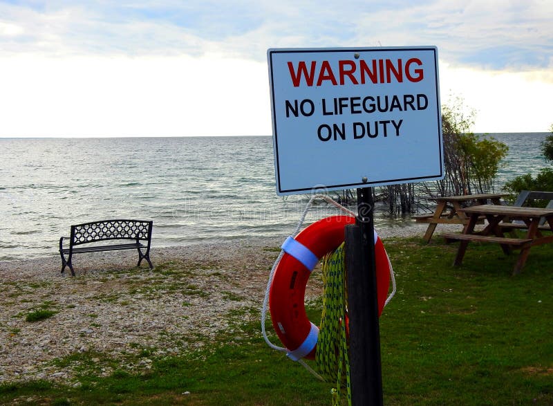 Life Saving Ring on Post with Sign Stock Photo - Image of warning, ring ...