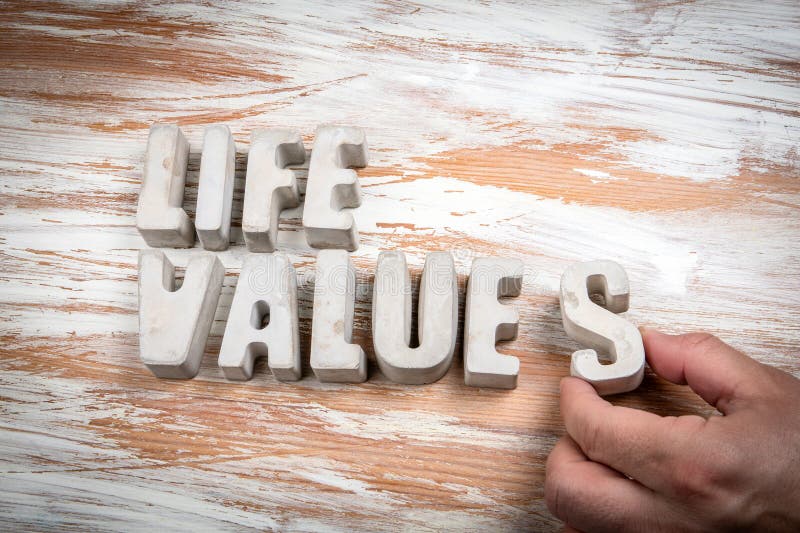 Life Values. Concrete Alphabet Letters on a Light Painted Wood Texture ...