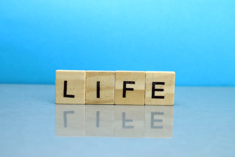 Life Word Made of Wooden Blocks on a Blue Background Stock Photo ...