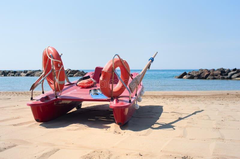 Lifeboat on Empty Beach in Summer Day Stock Photo - Image of rock ...