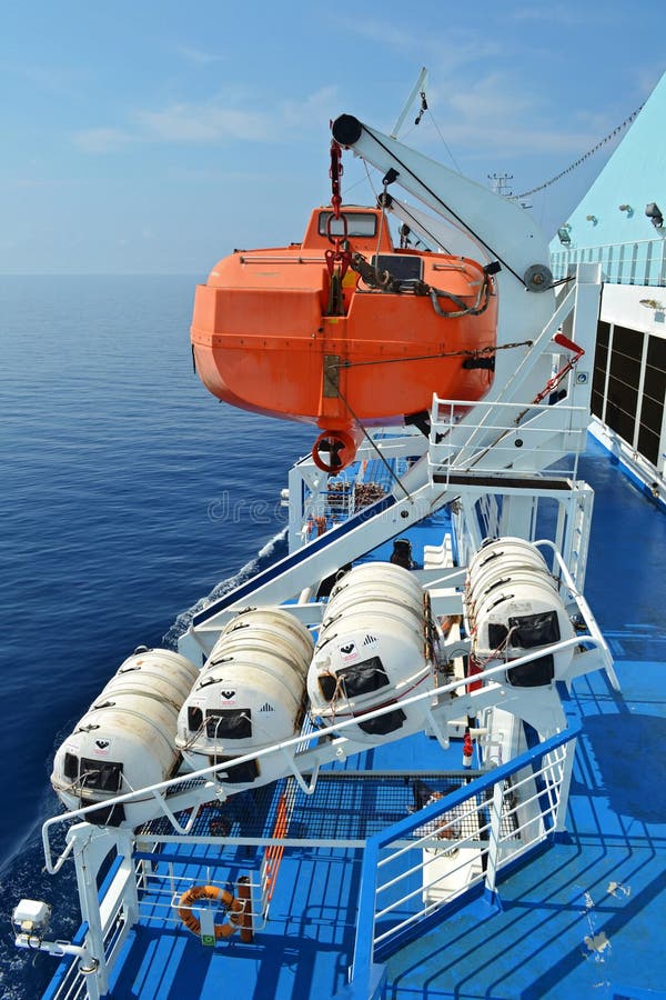 Orange Lifeboat on Deck of Cruise Ship Stock Photo - Image of hanging ...
