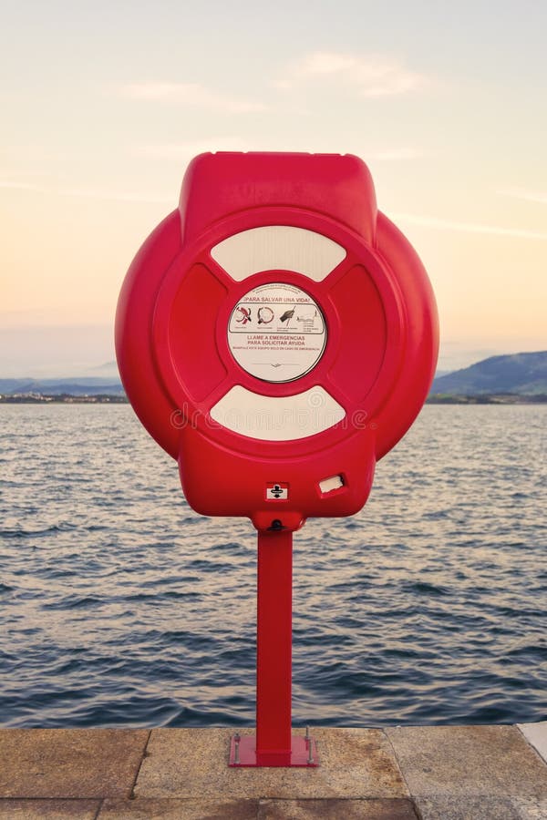 Lifebuoy Inside Its Protective Box at the Edge of the Sea. Front Stock ...