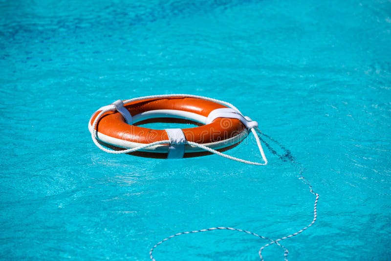 Lifebuoy Pool Ring Float on Blue Water. Stock Photo - Image of summer ...
