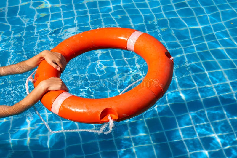 Lifeguard Girl Training with a Life Preserver Swimming in the Pool ...