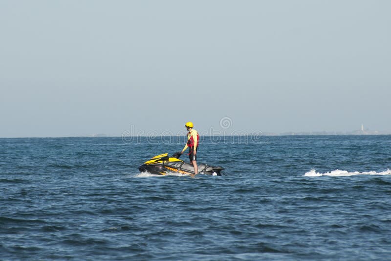 Lifeguard on a Jet Ski editorial stock photo. Image of lifeguard - 93980218