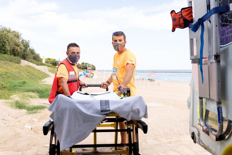 Lifeguard Staff Working on the Beach Using a Stretcher Stock Image ...
