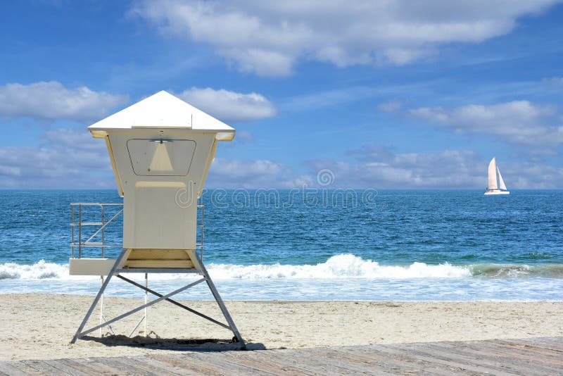 Lifeguard Stand on a Beach with the Ocean and Waves and Cloudy Sky and ...