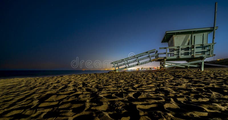 Night Time Photograph of a Life Guard Tower on the Beach Stock Photo ...