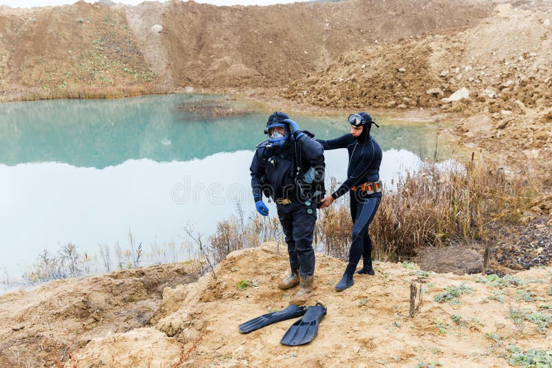 Lifeguard in a Wetsuit To Work Underwater. Search at the Bottom of the ...