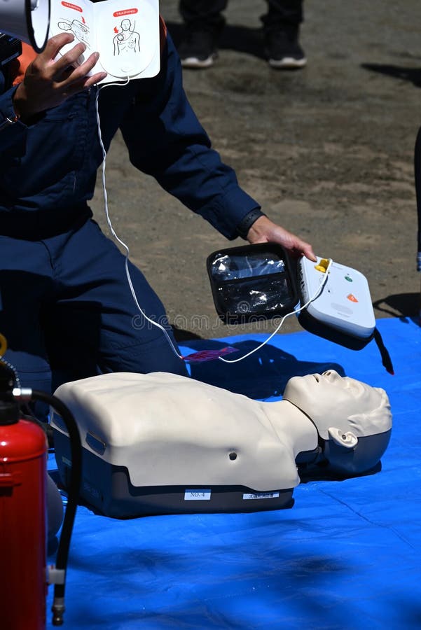 Lifesaving Training Using an AED. Stock Photo - Image of human ...