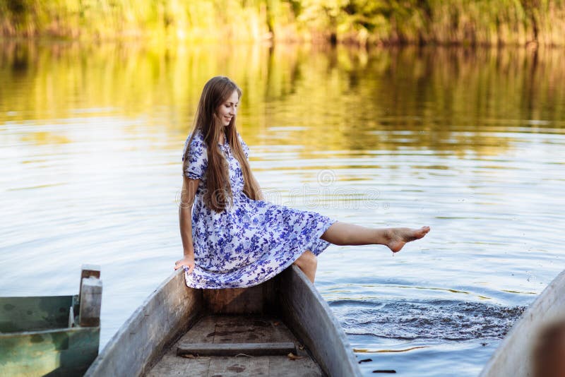 Lifestyle Portrait of Young Beautiful Woman Sitting at Motorboat. Girl ... Lifestyle Portrait of Young Beautiful Woman Sitting at Motorboat. Girl ...