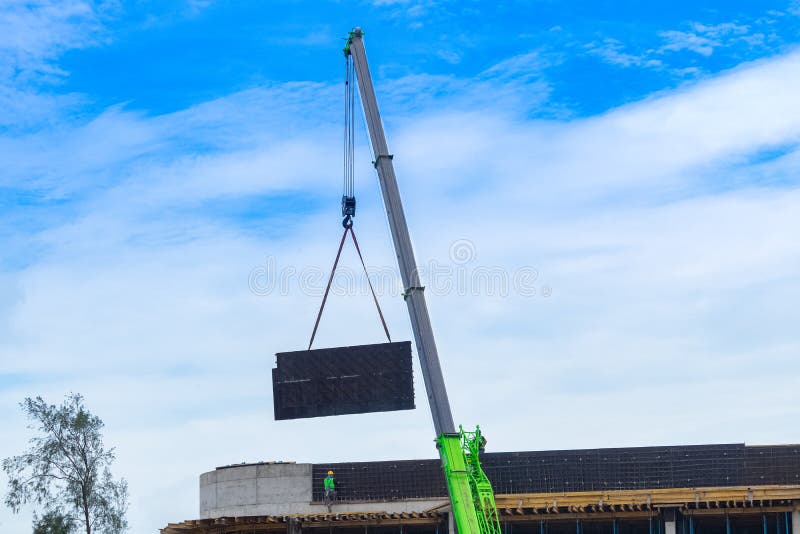 Lifting Crane and Modern Houses Under Construction Stock Photo - Image ...