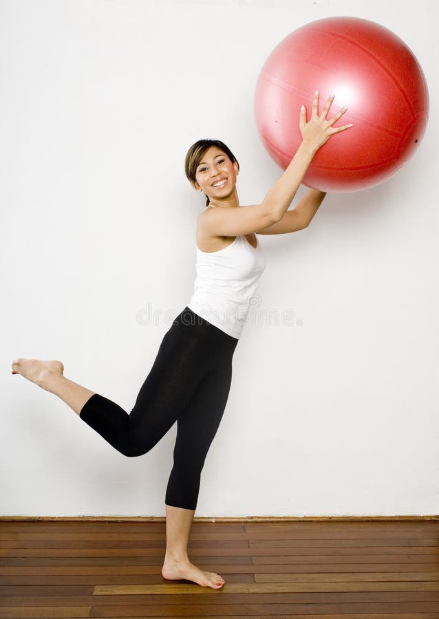 Lifting Fitness Ball stock photo. Image of attractive - 2355328