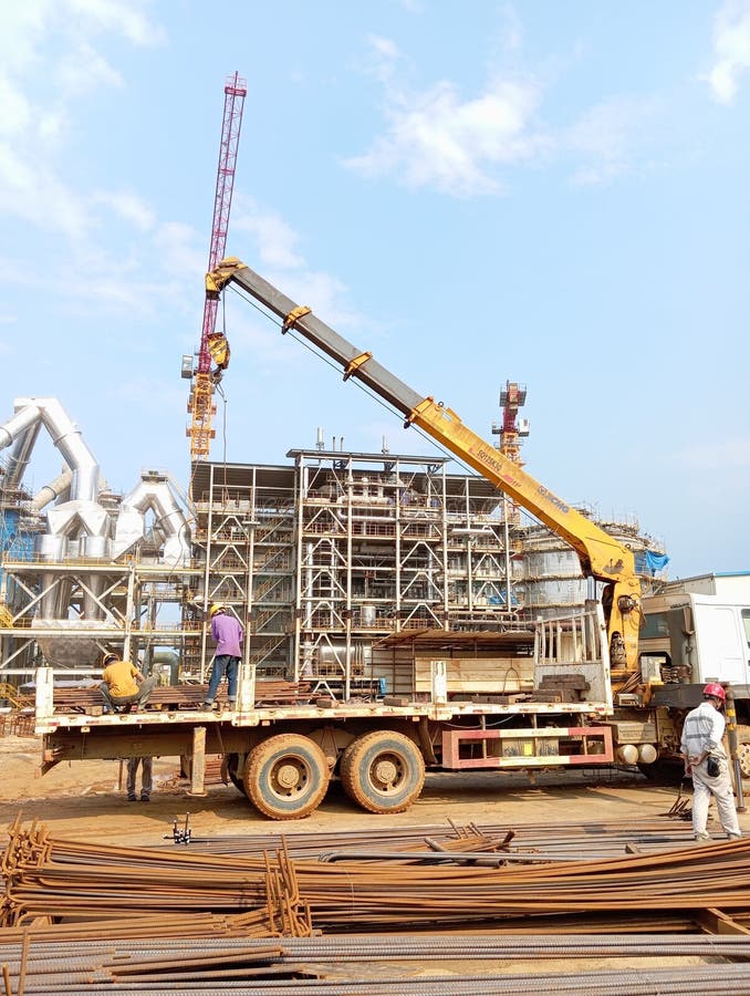 Lifting Iron Using a Crane at a Construction Site Editorial Photo ...