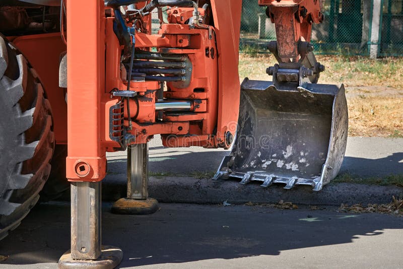 The Lifting Machine Excavator Bulldozer Stands on Stops, Rests on the ...