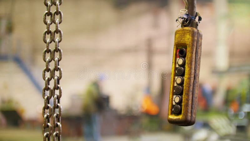 A Lifting Machine on the Plant. a Control Panel and a Chain Hanging in ...