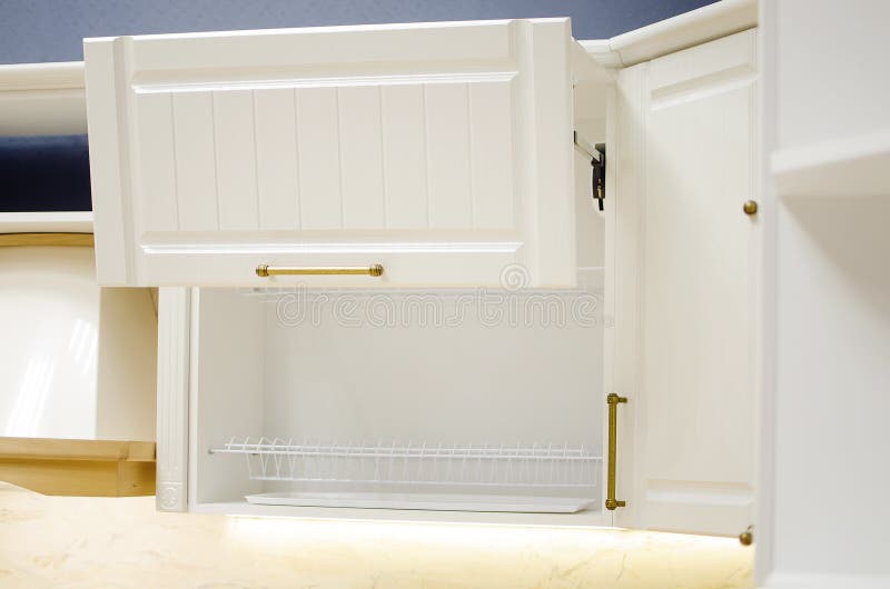 Lifting Mechanism of the Kitchen Facade. a White Kitchen Cabinet Opens ...