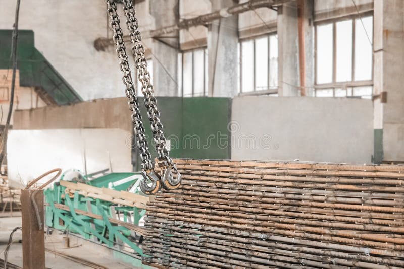 Lifting Mechanism of an Overhead Crane with a Hook and Chain Next To ...