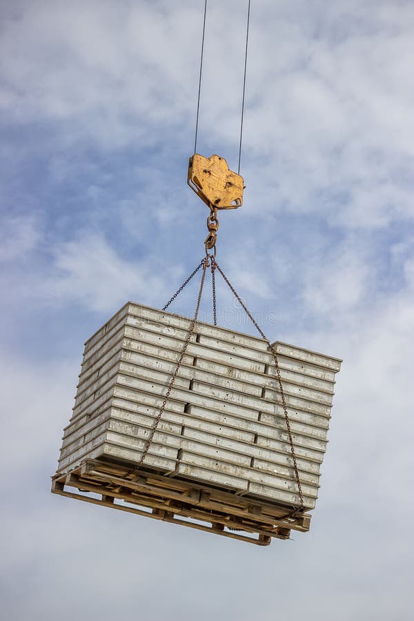 Lifting Pallet with Formwork Elements by Crane Stock Photo - Image of ...