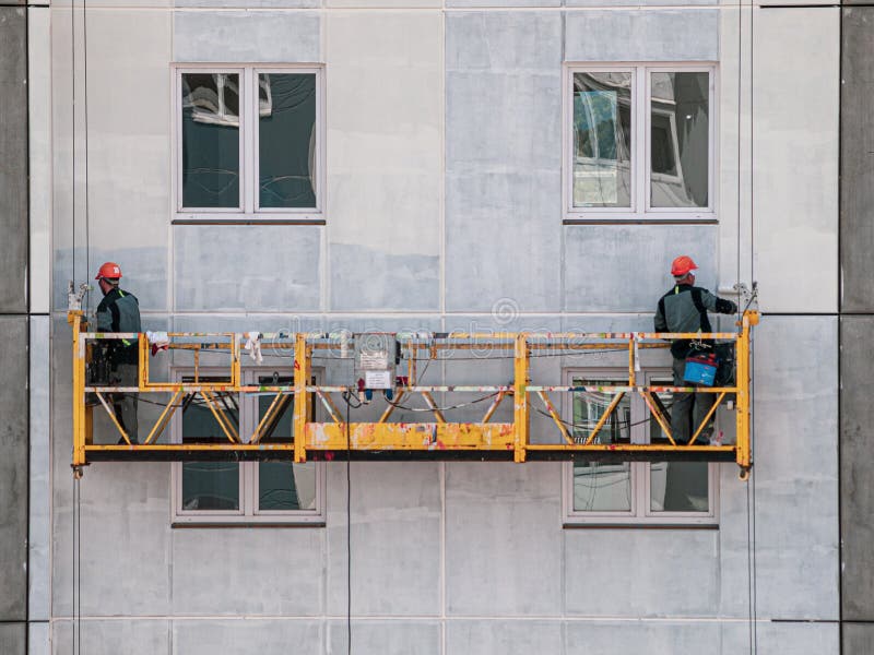 Lifting Platform for Construction Workers Working on the Facade of a ...