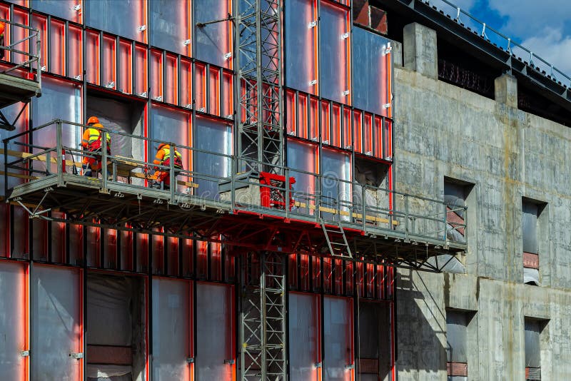 Lifting Platform with Workers from the Outside of the Wall of the House ...