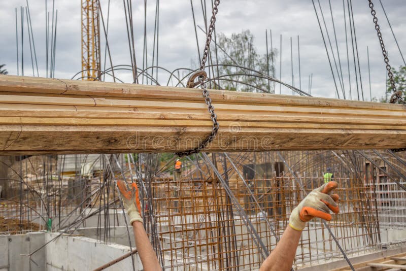 Lifting Timber Plank for Formwork Stock Image - Image of reinforce ...