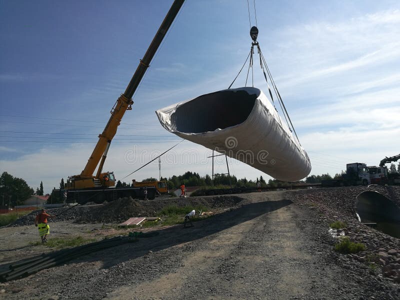 Lifting a tube editorial photo. Image of road, tube - 125726911