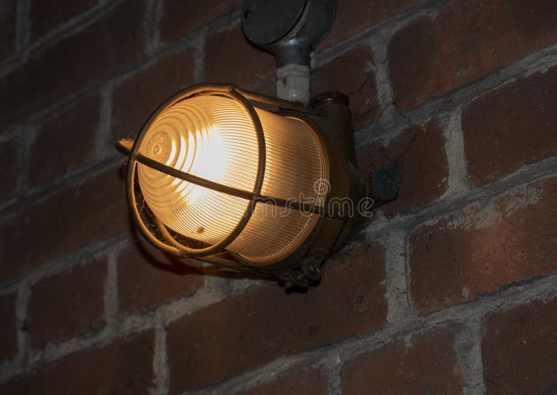 Industrial Vintage Bunker Light on Old Brick Wall Stock Photo - Image ...